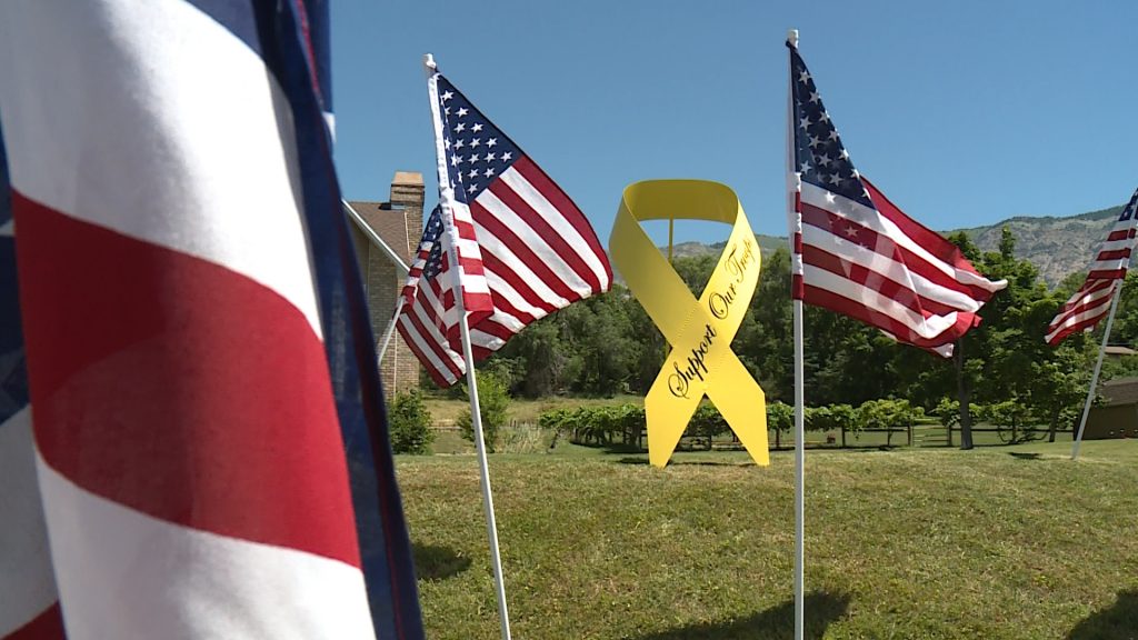 Volunteers Post Flags, Yellow Ribbons For Fallen North Ogden Soldier