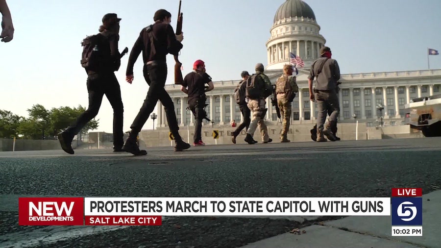 Protestors March To State Capitol Armed With Guns