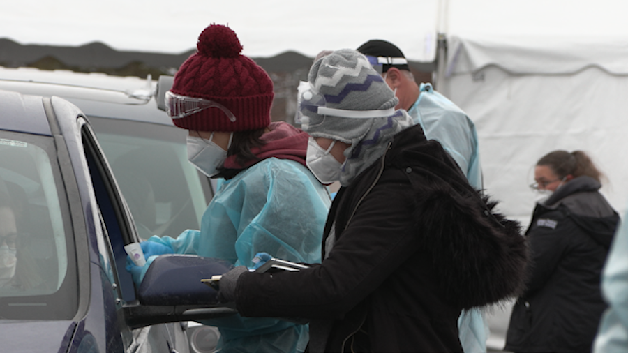 People waiting hours in COVID-19 testing lines