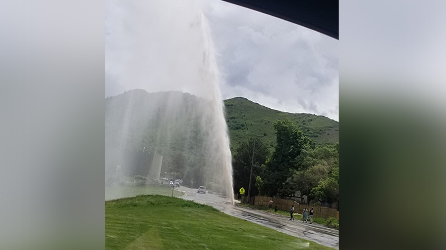 Water bursts out of Millcreek road due to broken water line