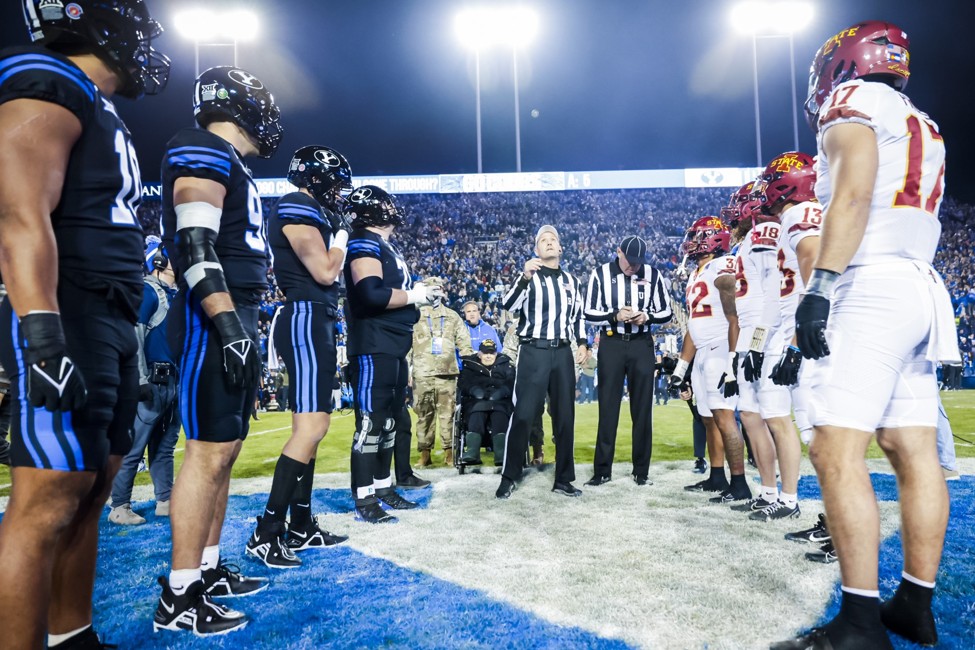 A 102-year-old WWII vet, BYU fan flips game coin at Veterans Day game ...