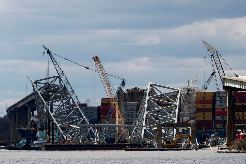 Salvage crews have begun removing containers from the ship that ...